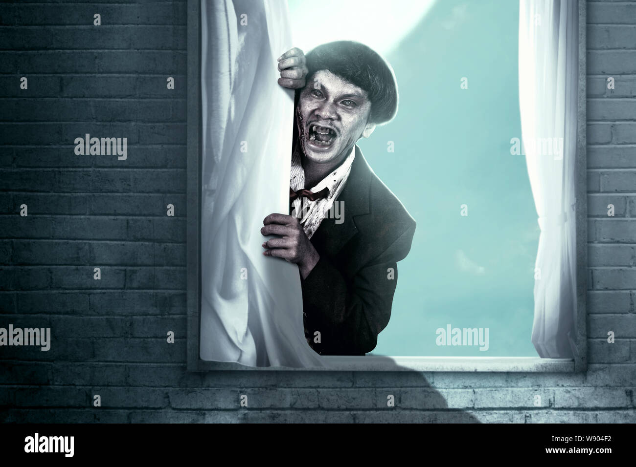 Scary zombies with blood and wound on his body haunted the abandoned ...