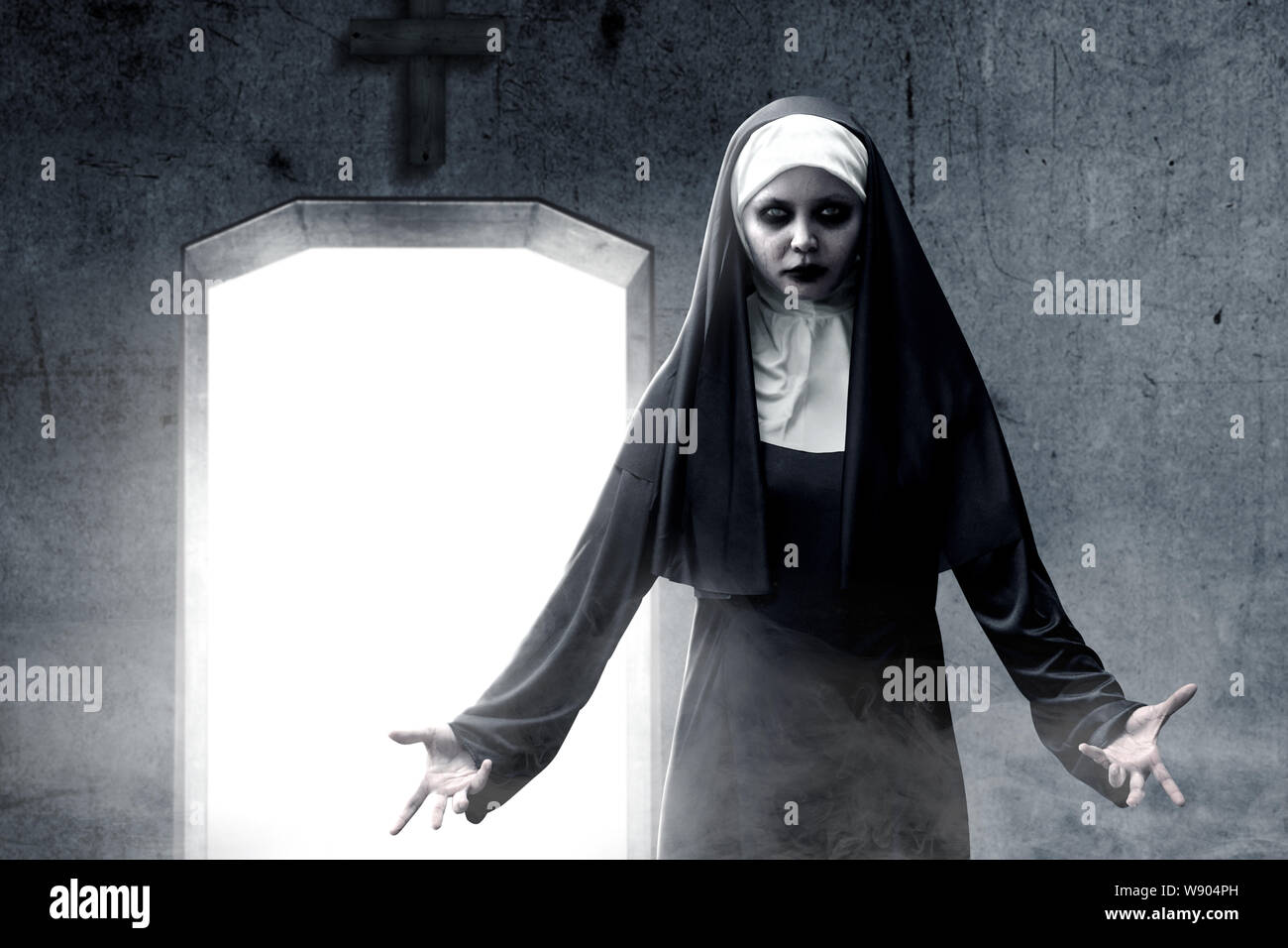 Frightening devil nun haunted the darkroom. Halloween concept Stock ...
