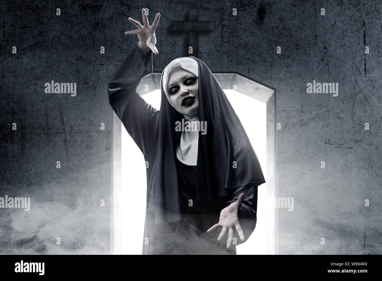 Frightening devil nun haunted the darkroom. Halloween concept Stock ...