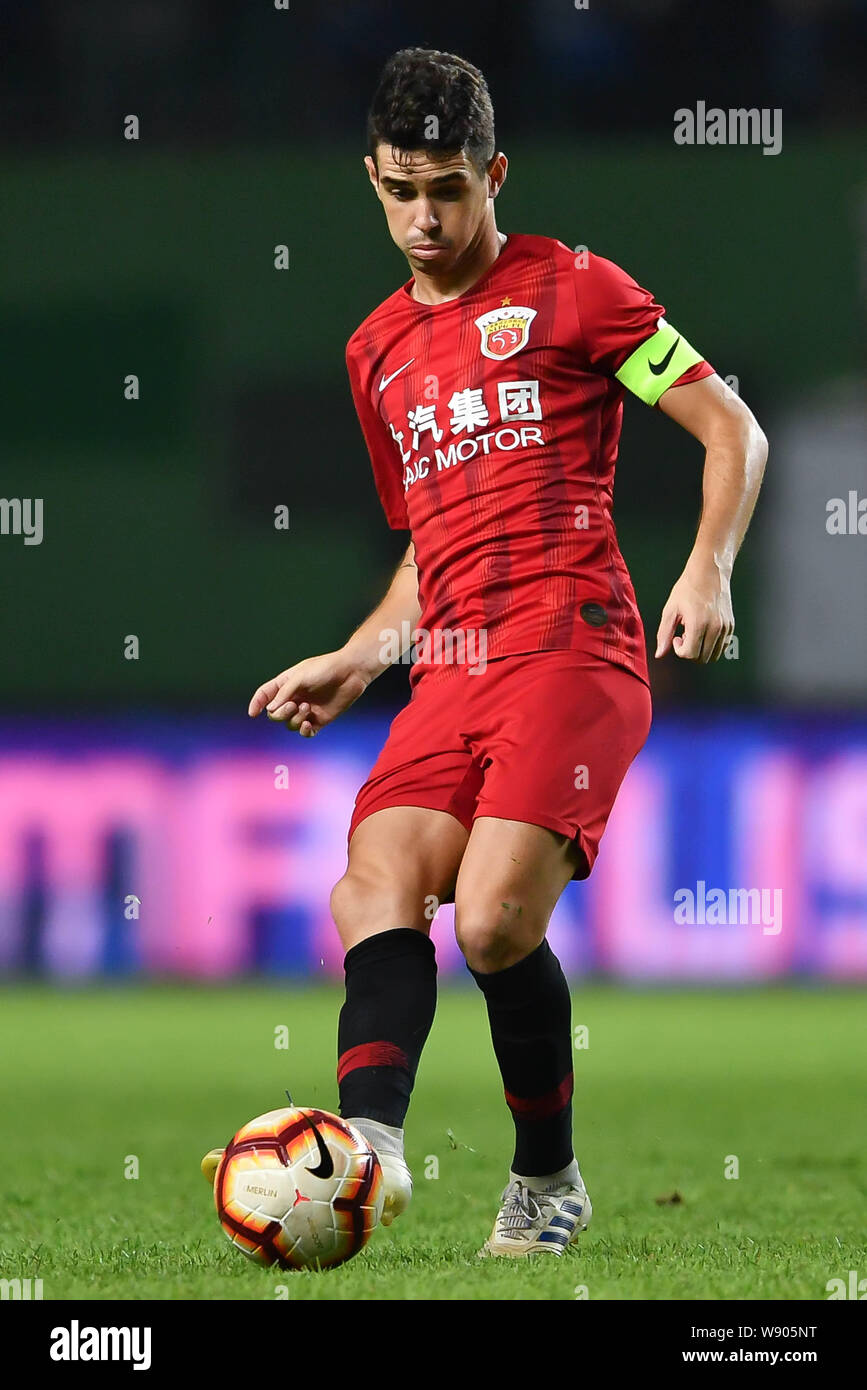 Brazilian football player Oscar dos Santos Emboaba Junior better known as simply Oscar of Shanghai SIPG F.C. plays during the 23th round of Chinese Football Association Super League CSL against Guangz...