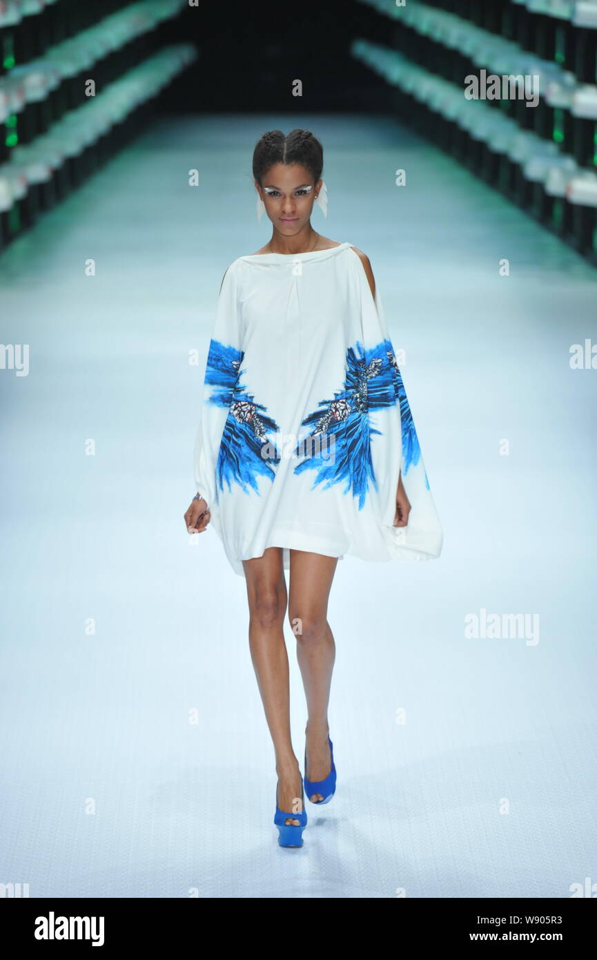 A model displays a new creation by designer Liu Wei at the Toray Liu ...