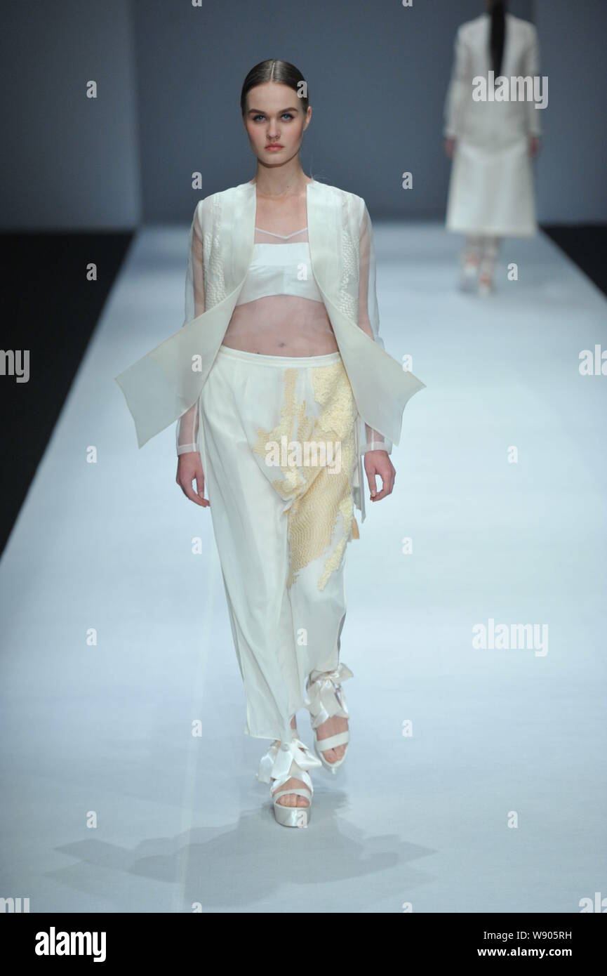 A model displays a new creation by designer Yi Ya at the Y¯iLuck Yi Ya ...