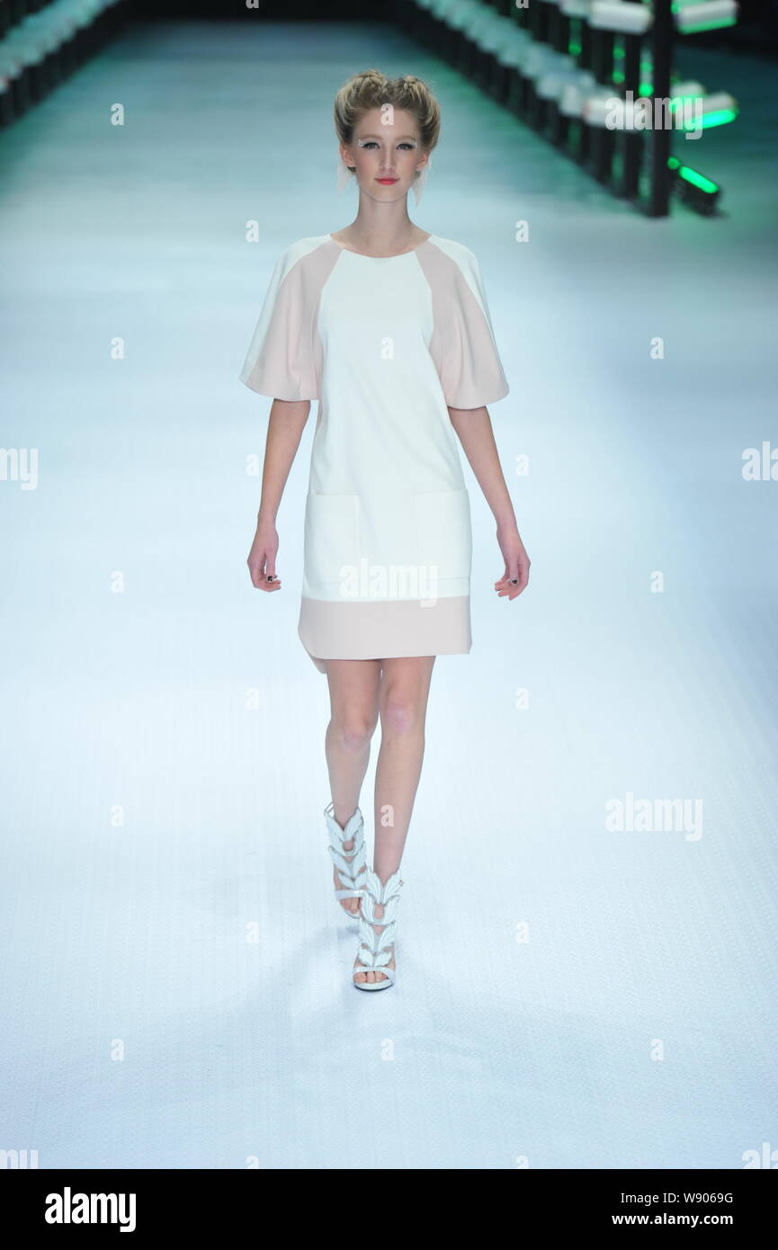 A model displays a new creation by designer Liu Wei at the Toray Liu ...