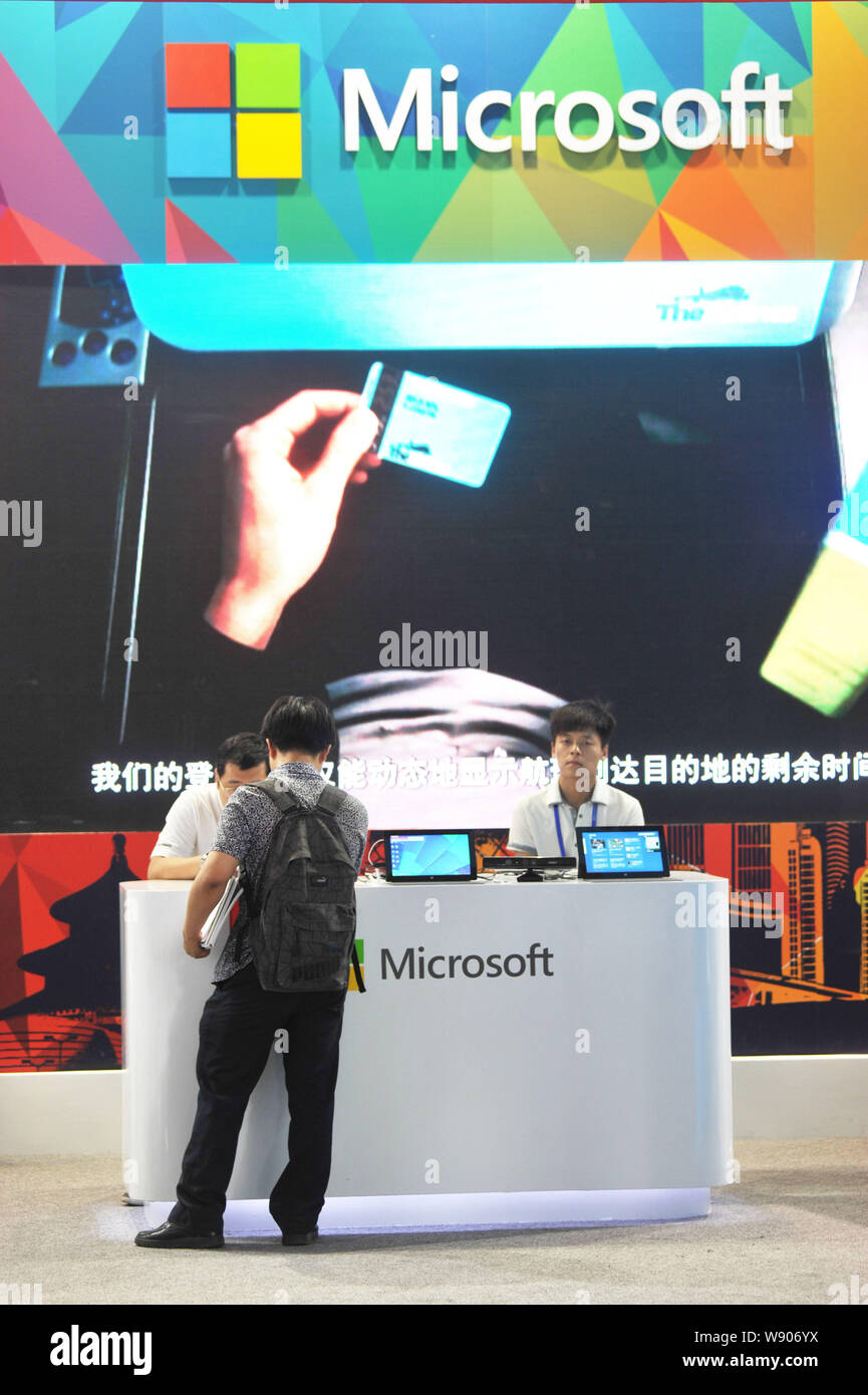 --FILE--A visitor is seen at the stand of Microsoft during the 18th ...