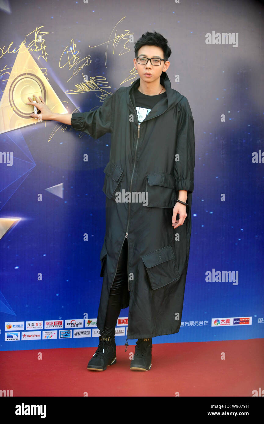 Chinese singer Hu Xia poses on the red carpet as he arrives at the ...