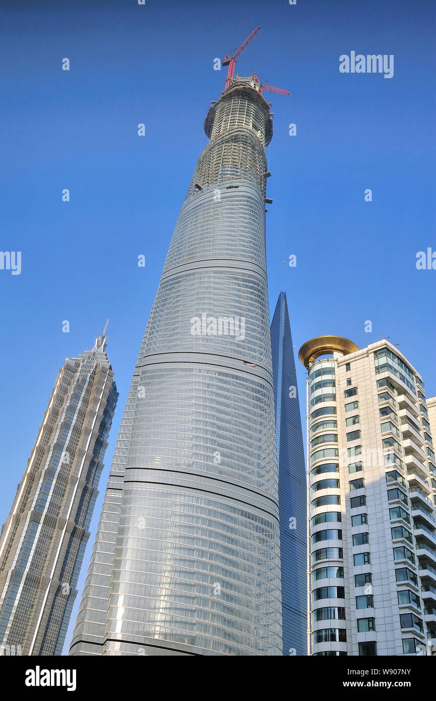 --FILE--The Shanghai Tower, tallest, is under construction next to ...