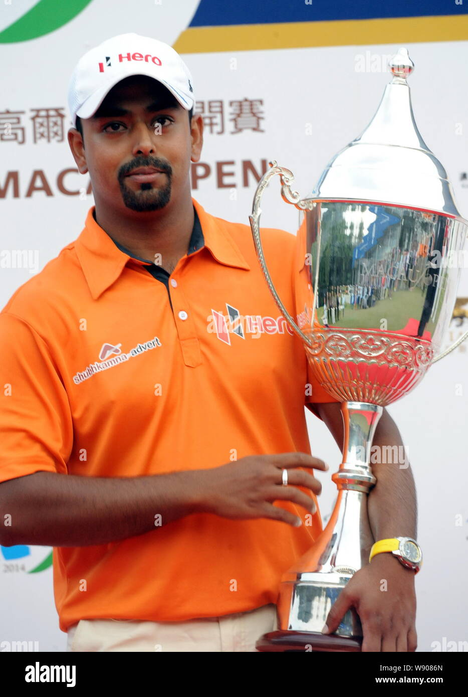 Indian golfer Anirban Lahiri poses with his trophy during the Venetian ...