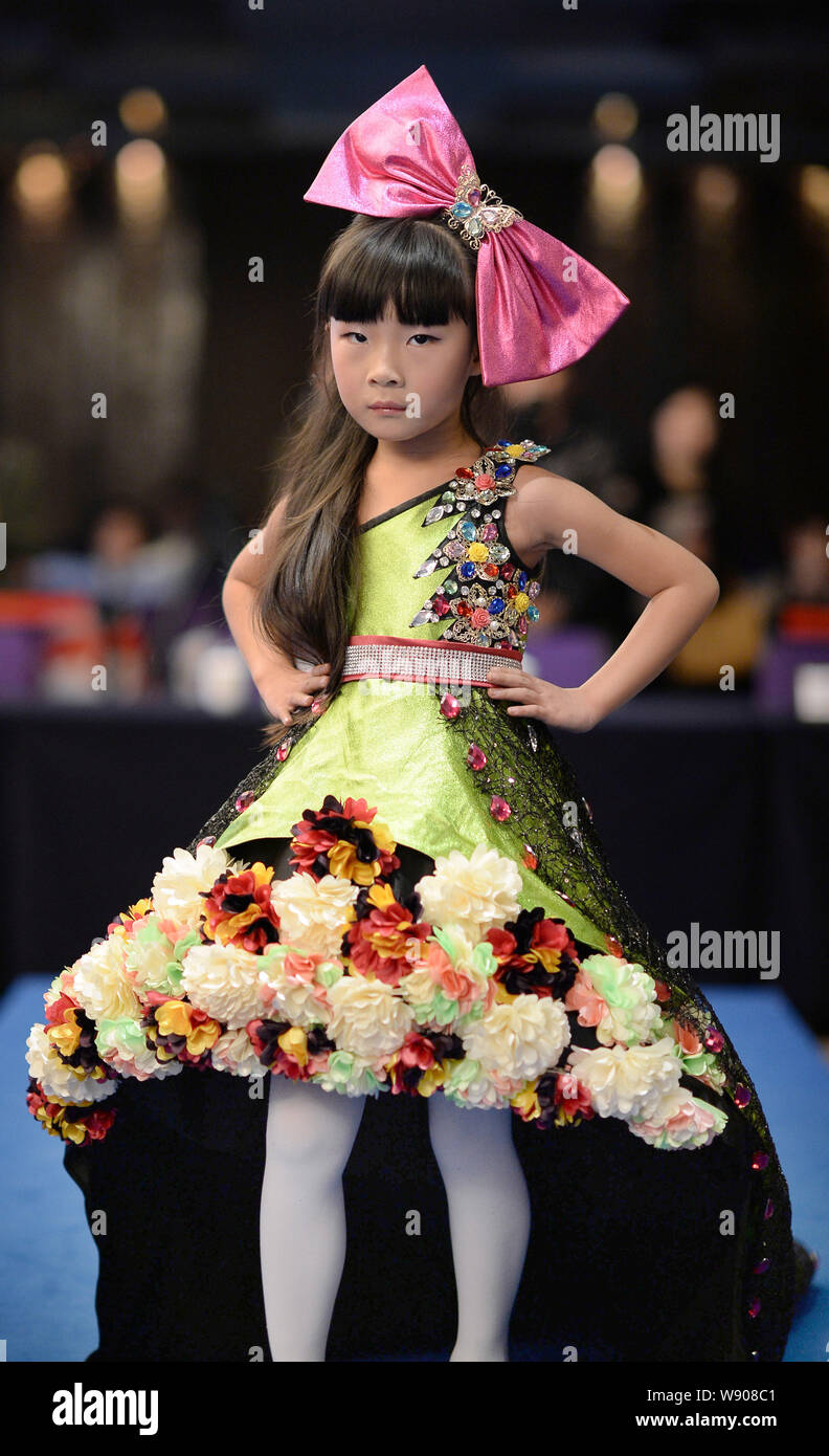 6-year-old Chinese child model Zhou Ziling poses during a competition ...