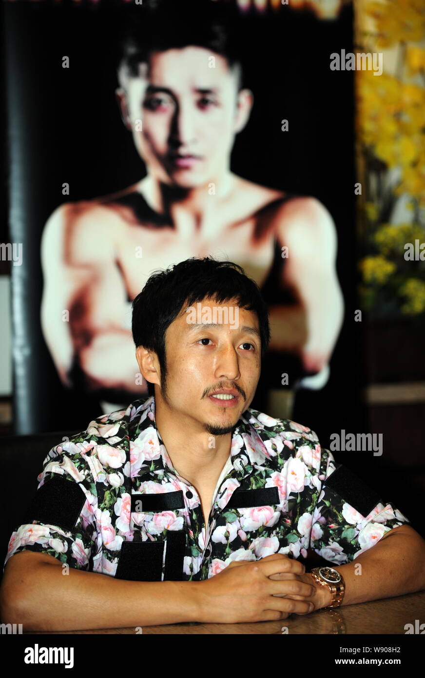 Chinese boxer Zou Shiming speaks at an interview ahead of Champions of ...