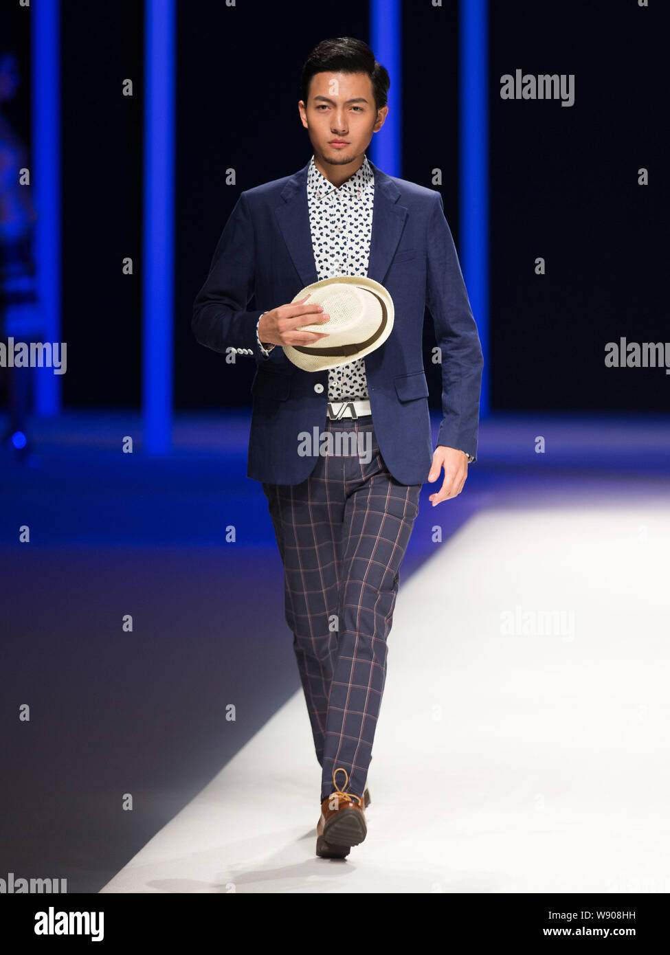 A model displays a new creation by designer Yuan Bing at the VISCAP ...