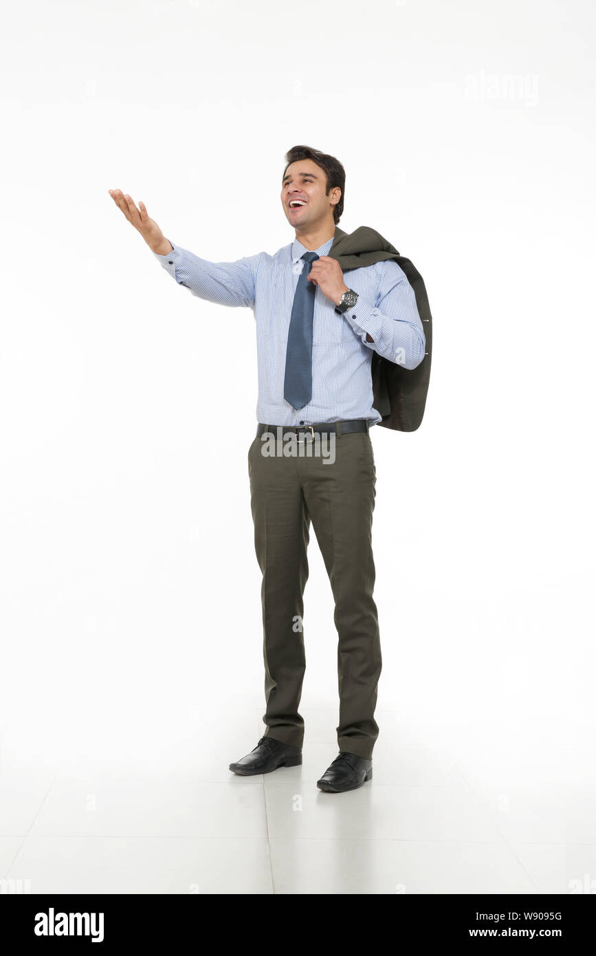 Smiling standing looking away gesturing hi-res stock photography and ...