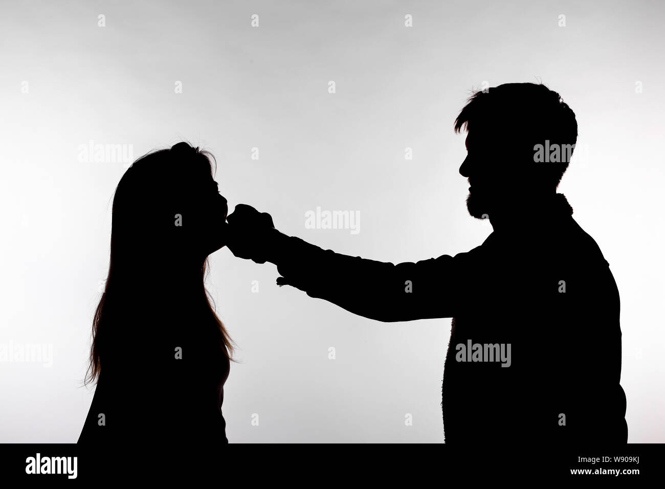 Domestic violence and abuse concept - Silhouette of man beating ...