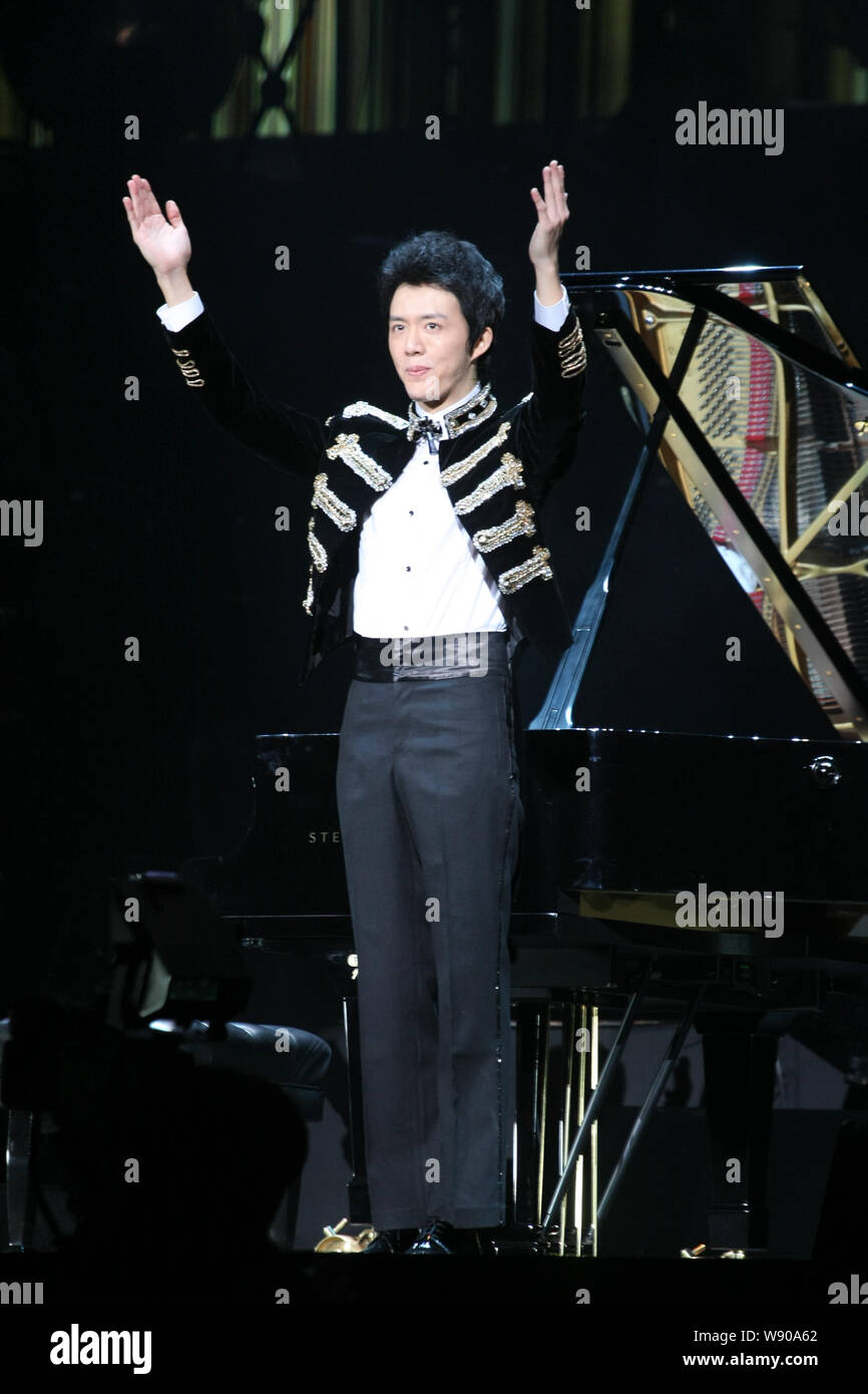 Chinese pianist Li Yundi poses at his "Emperor Fantasy" piano concert ...