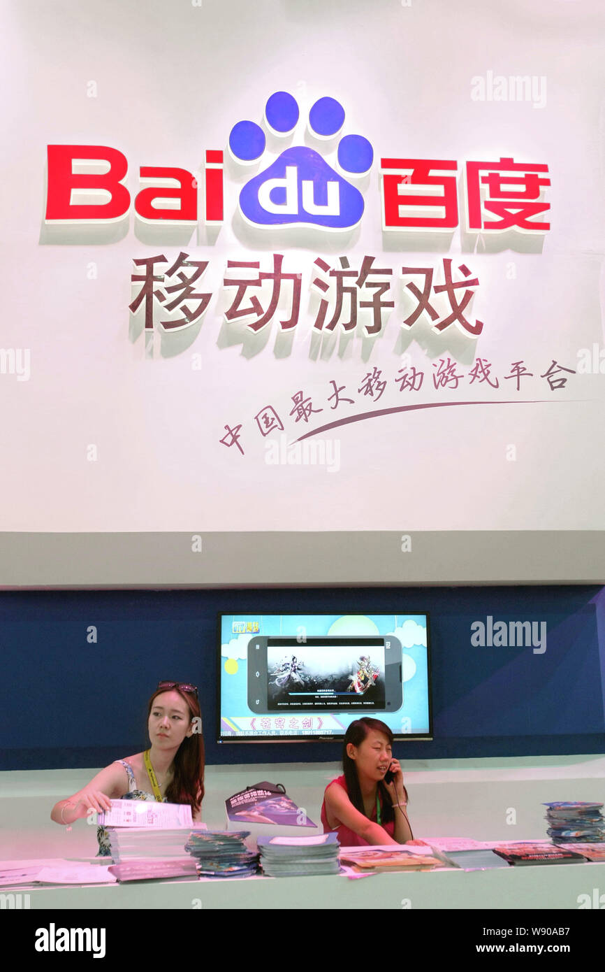 --FILE--Chinese employees work at the stand of Baidu during a fair in ...
