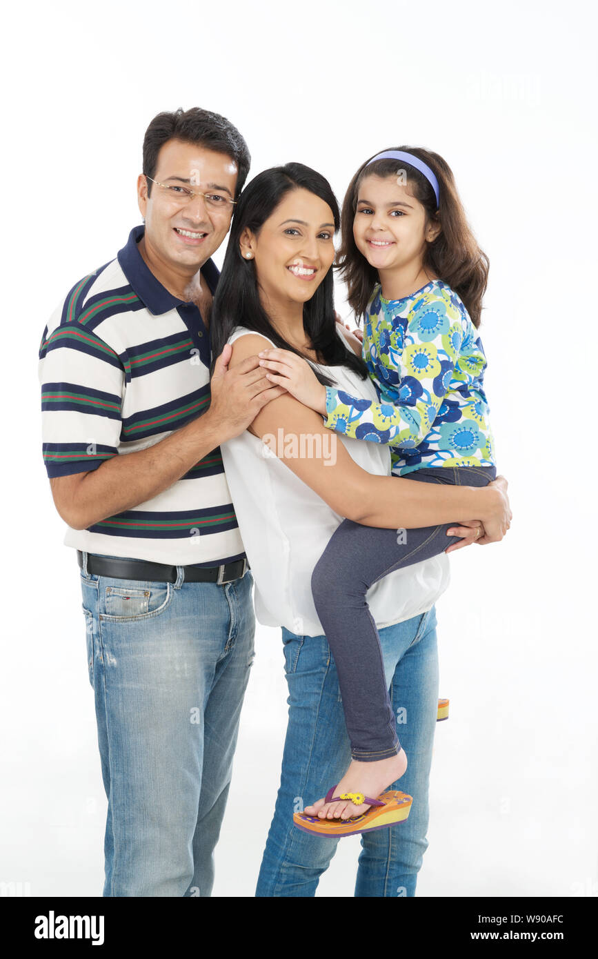 Family standing together and smiling Stock Photo - Alamy
