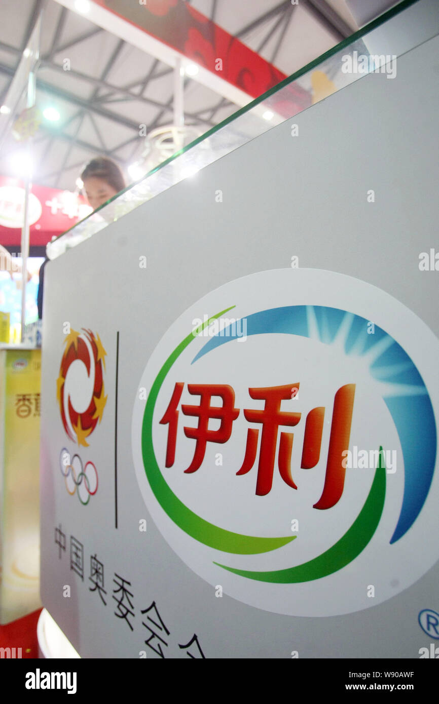 --FILE--A Chinese employee works at the stand of Yili during a fair in ...