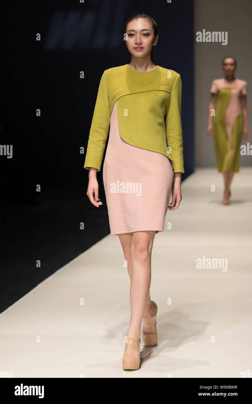 A model displays a creation by a postgraduate at a fashion show for ...