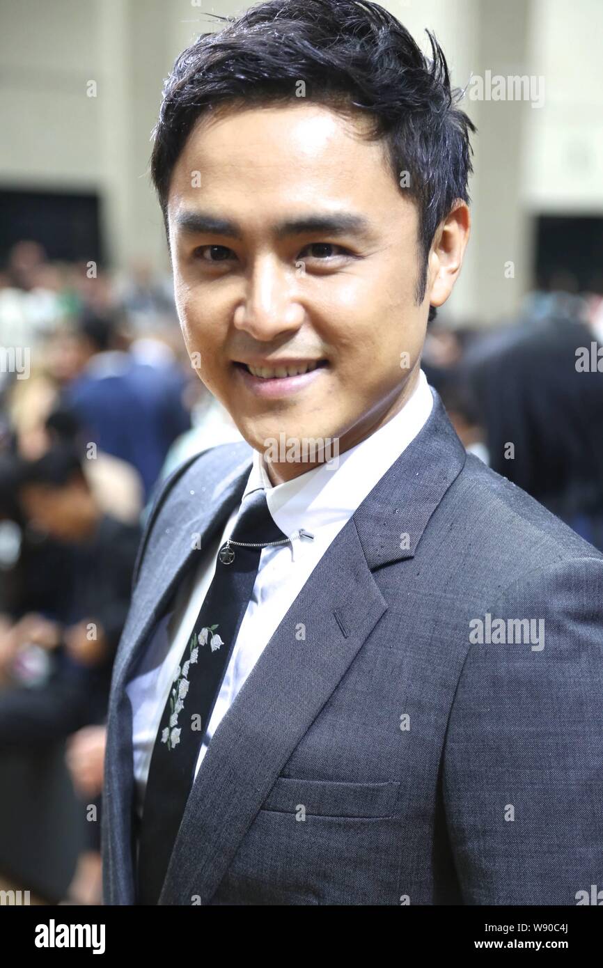 Taiwanese actor Ming Dow smiles at Dior Homme Fashion Show during the ...