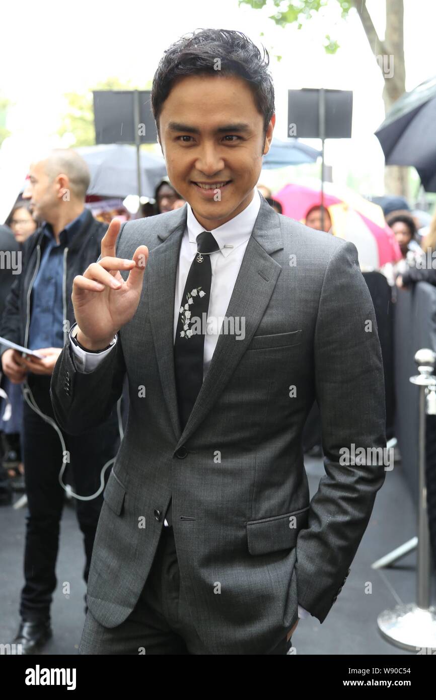Taiwanese actor Ming Dow smiles as he arrives at Dior Homme Fashion ...