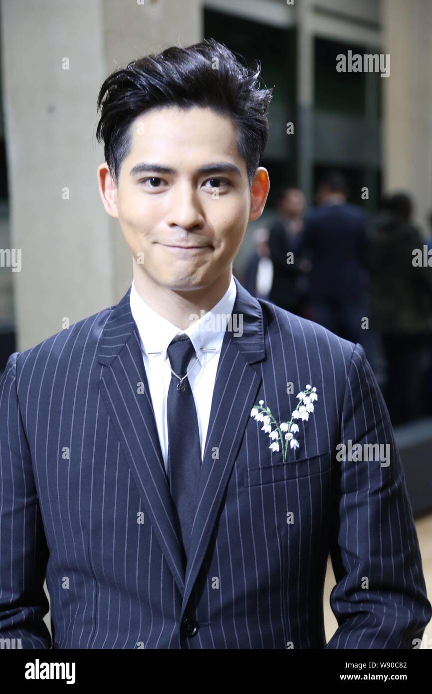 Taiwanese actor Vic Zhou smiles at Dior Homme Fashion Show during the ...