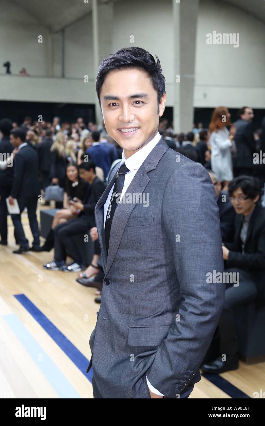 Taiwanese actor Ming Dow smiles at Dior Homme Fashion Show during the ...