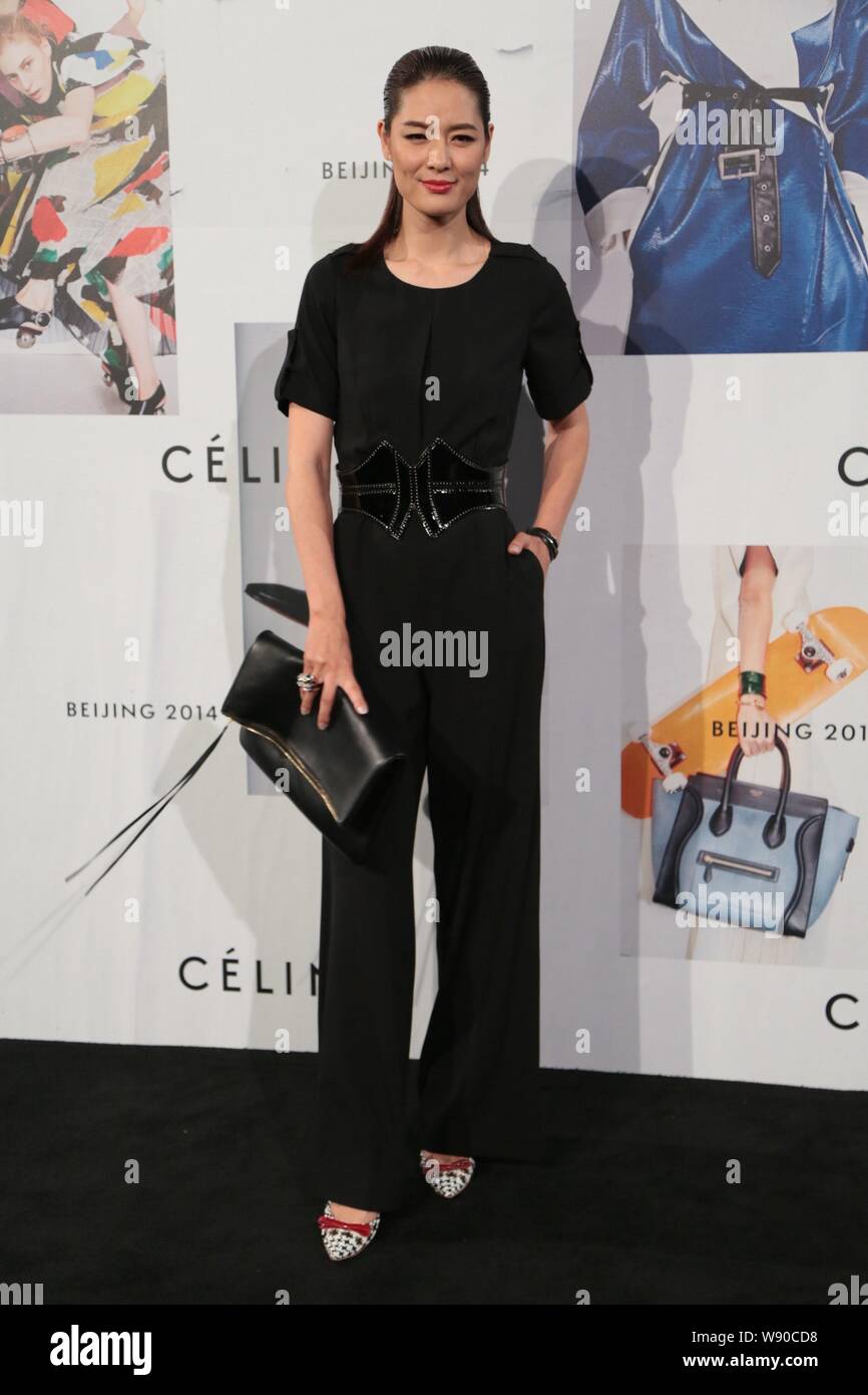 Chinese fashion designer Mary Ma Yanli poses as she arrives at the ...