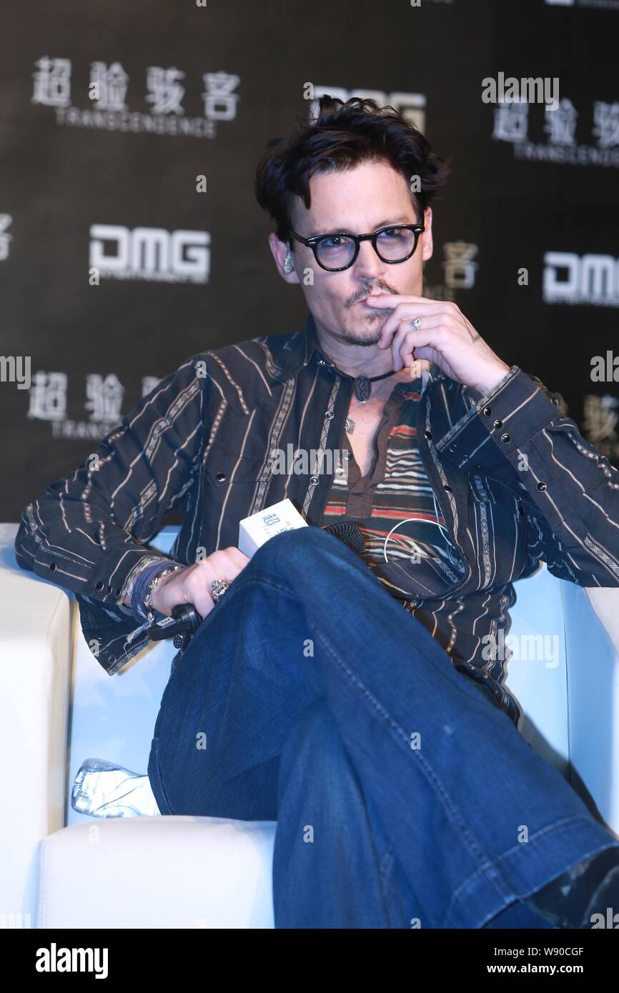 American actor Johnny Depp shows off his new engagement ring on his ...