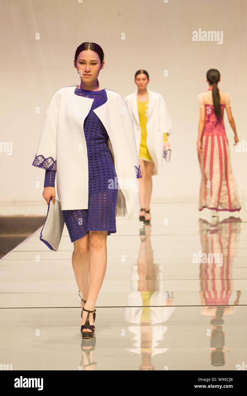 A model displays a new creation during a fashion show of Beijing ...