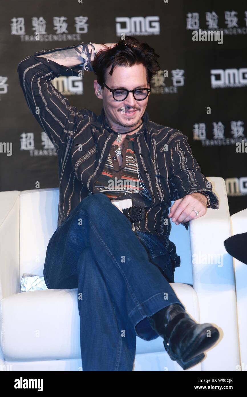 American actor Johnny Depp shows off his new engagement ring on his ...