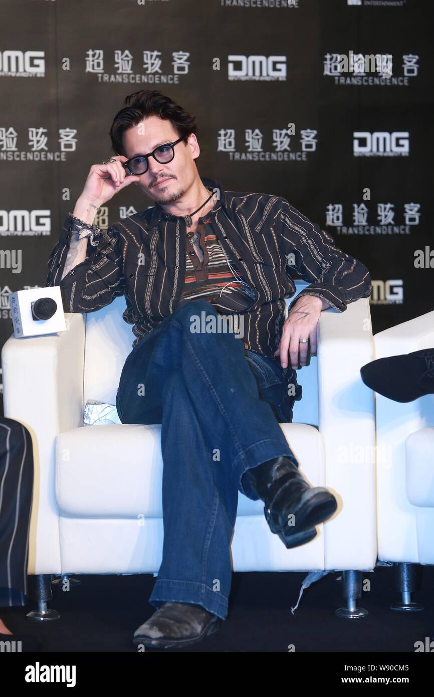 American actor Johnny Depp shows off his new engagement ring on his ...