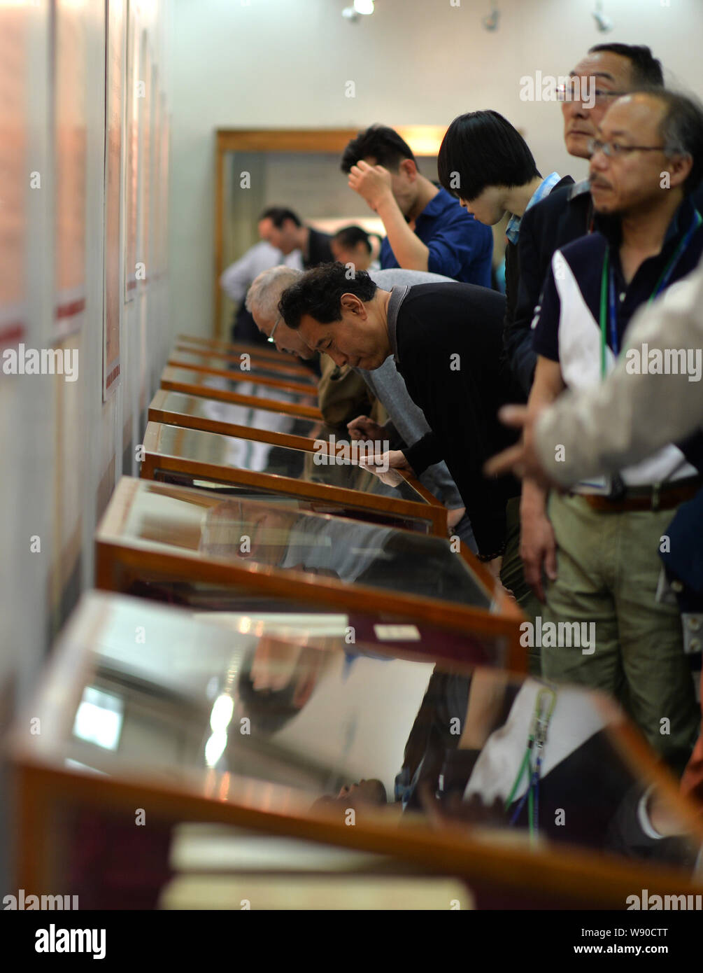 Visitors view ancient Chinese books bought back from Japan during an ...
