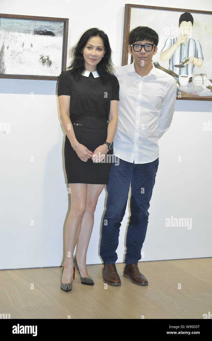 Hong Kong actress Carina Lau, left, poses with Chinese artist Cheng Ran during a media screening ...
