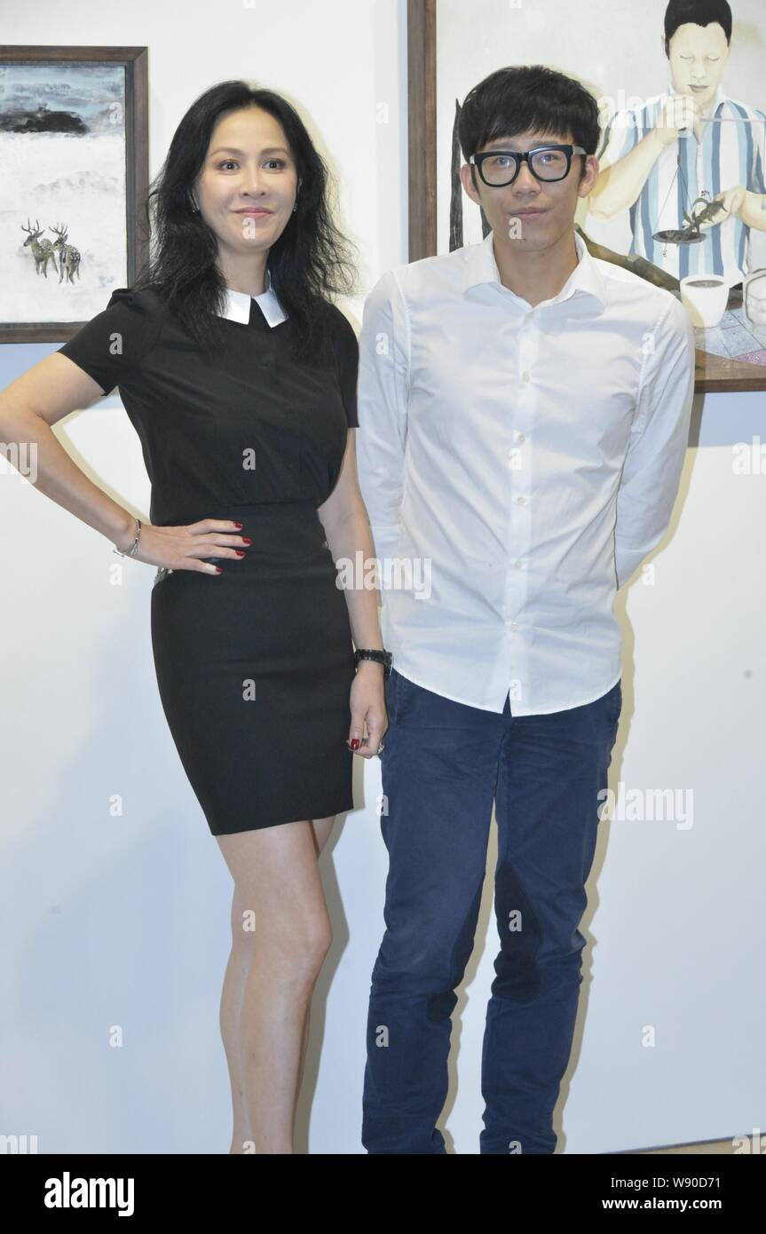 Hong Kong actress Carina Lau, left, poses with Chinese artist Cheng Ran ...