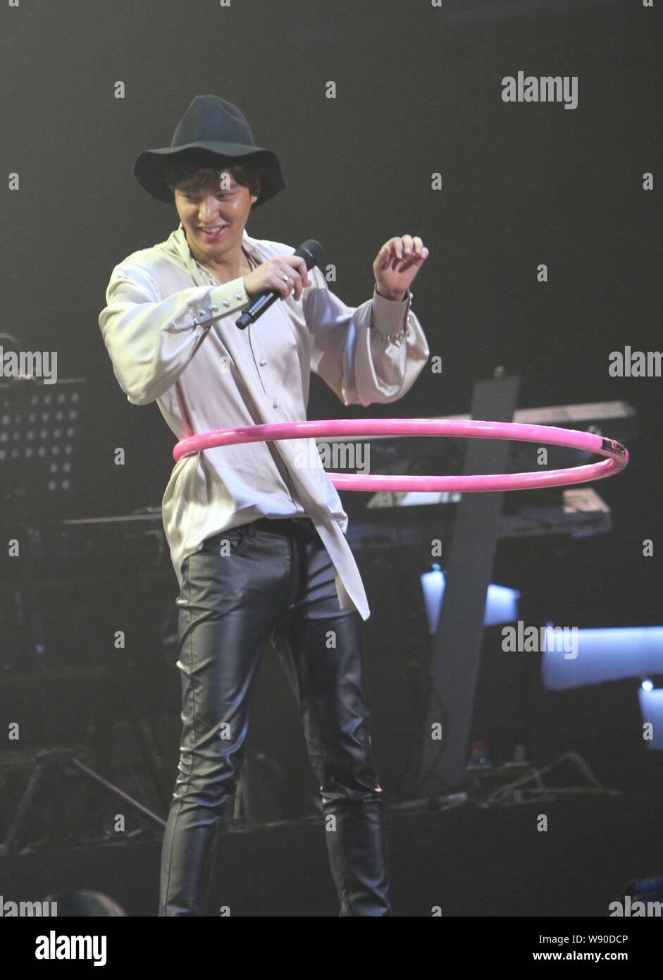 South Korean singer and actor Lee Min-ho plays with a hula-hoop during ...
