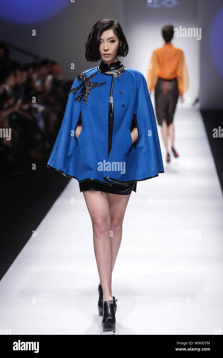 A model displays a new creation at the Royal Goldthread fashion show ...