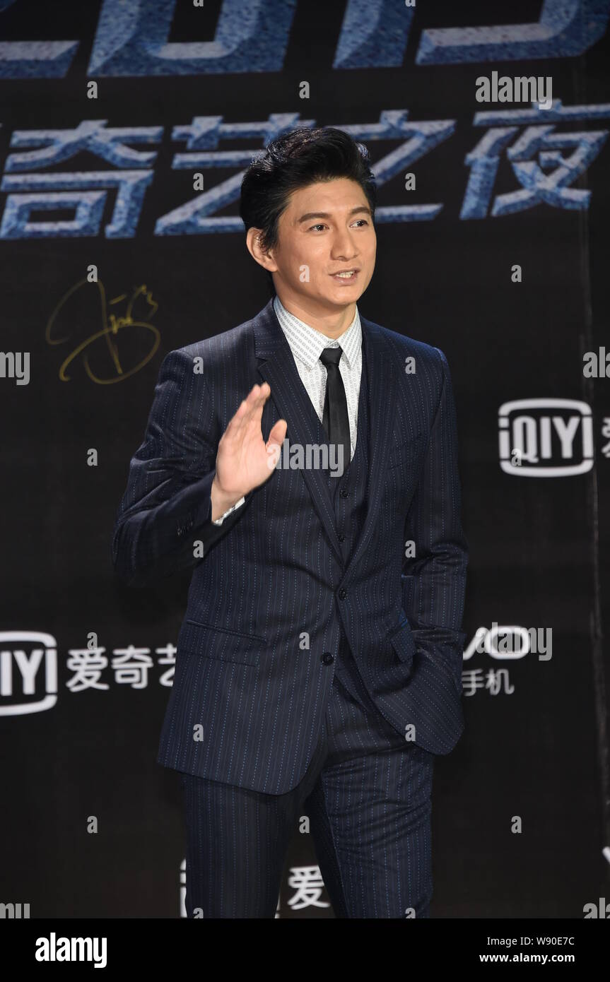 Taiwanese actor Nicky Wu waves during a fashion event by iQIYI in ...