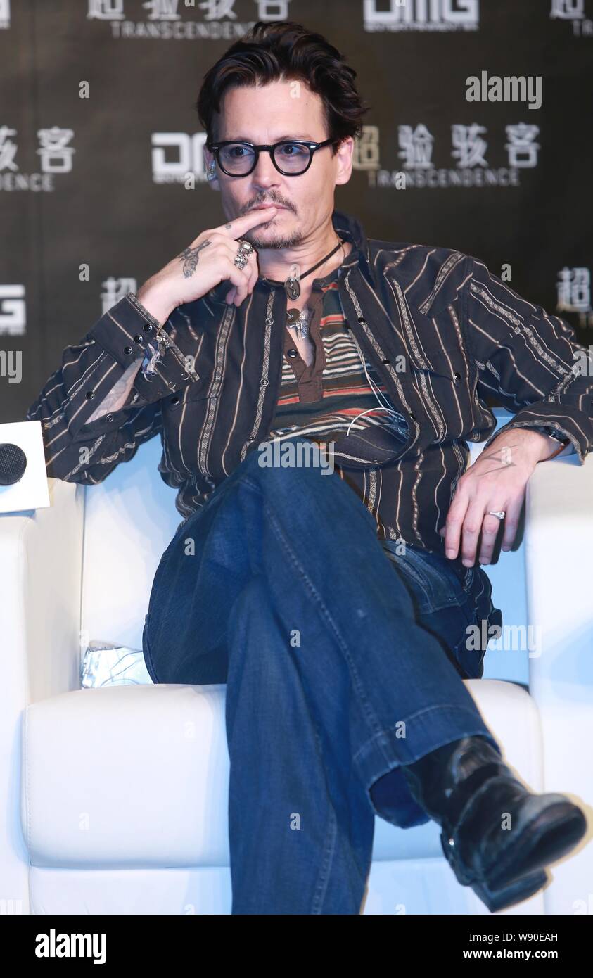 American actor Johnny Depp shows off his new engagement ring on his ...