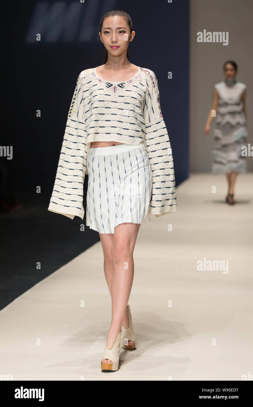 A model displays a creation by a postgraduate at a fashion show for ...