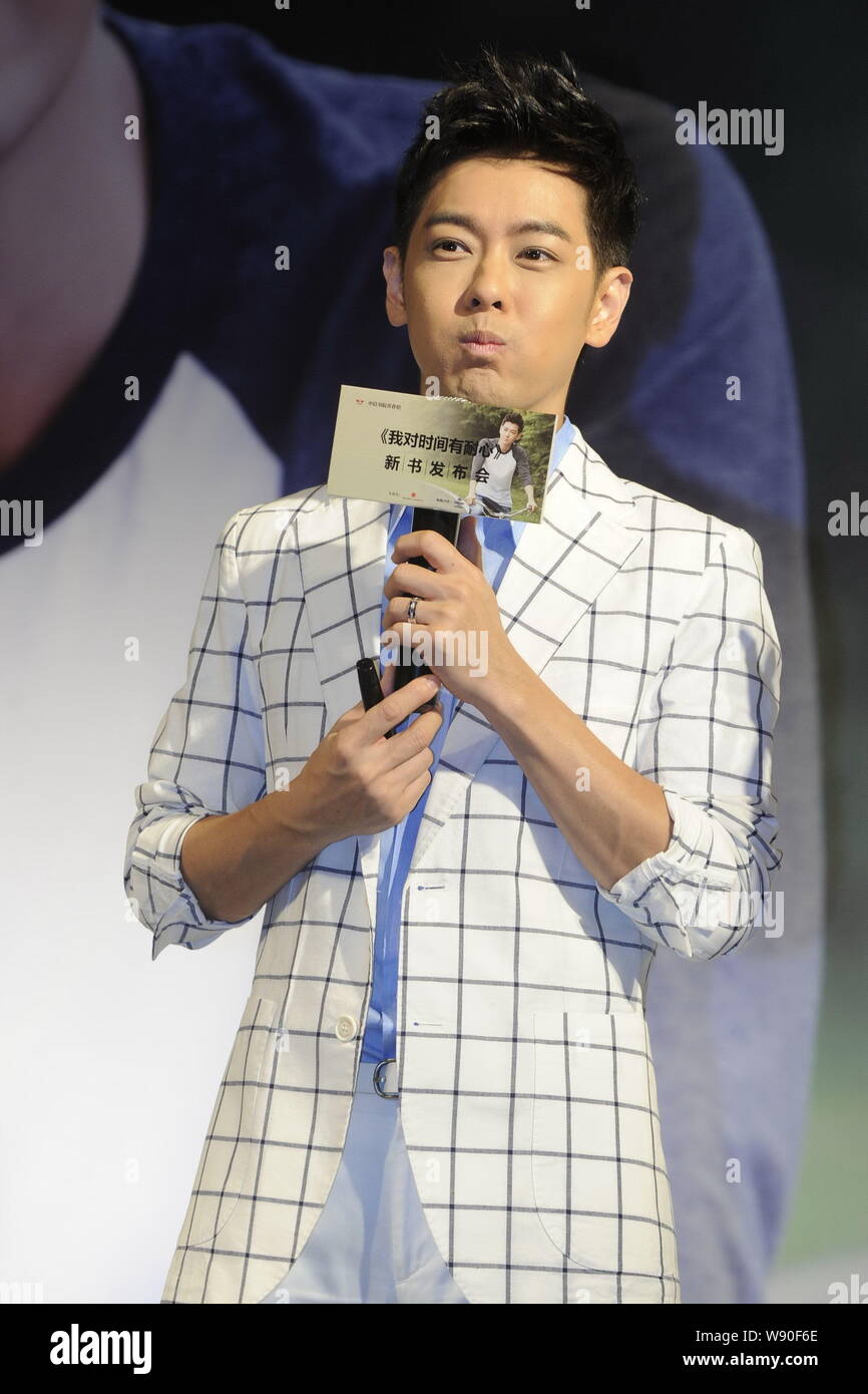 Taiwanese singer and actor Jimmy Lin makes faces during a press ...