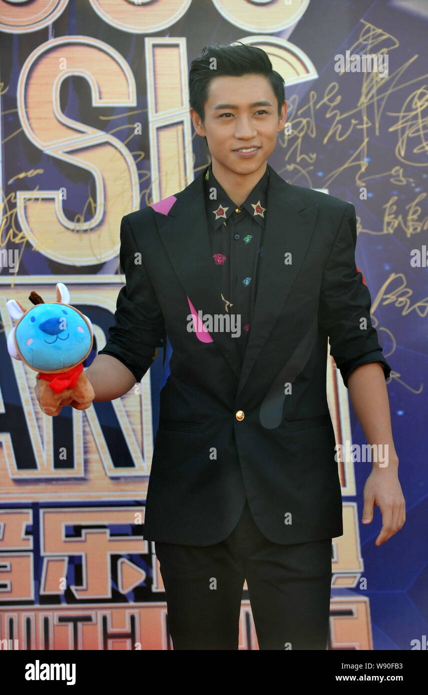 Chinese singer and actor Vision Wei Chen poses on the red carpet as he ...
