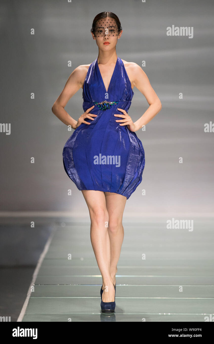 A model displays a creation designed by a student from the School of ...