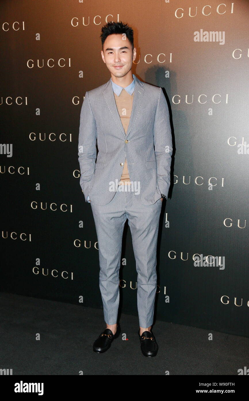 Taiwanese actor Ethan Juan poses as he arrives for a banquet for the ...