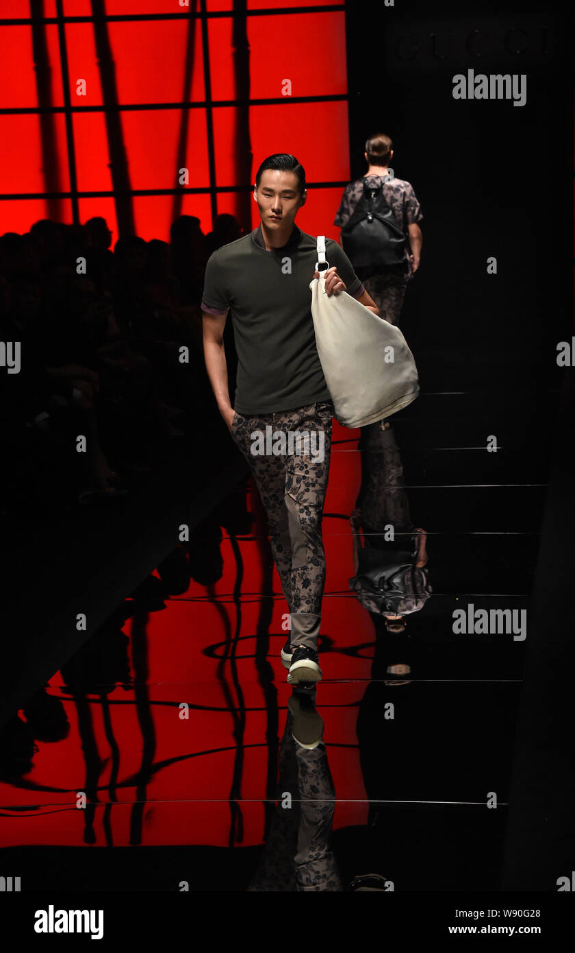 A model displays a new creation from the Gucci Spring/Summer 2014 ...