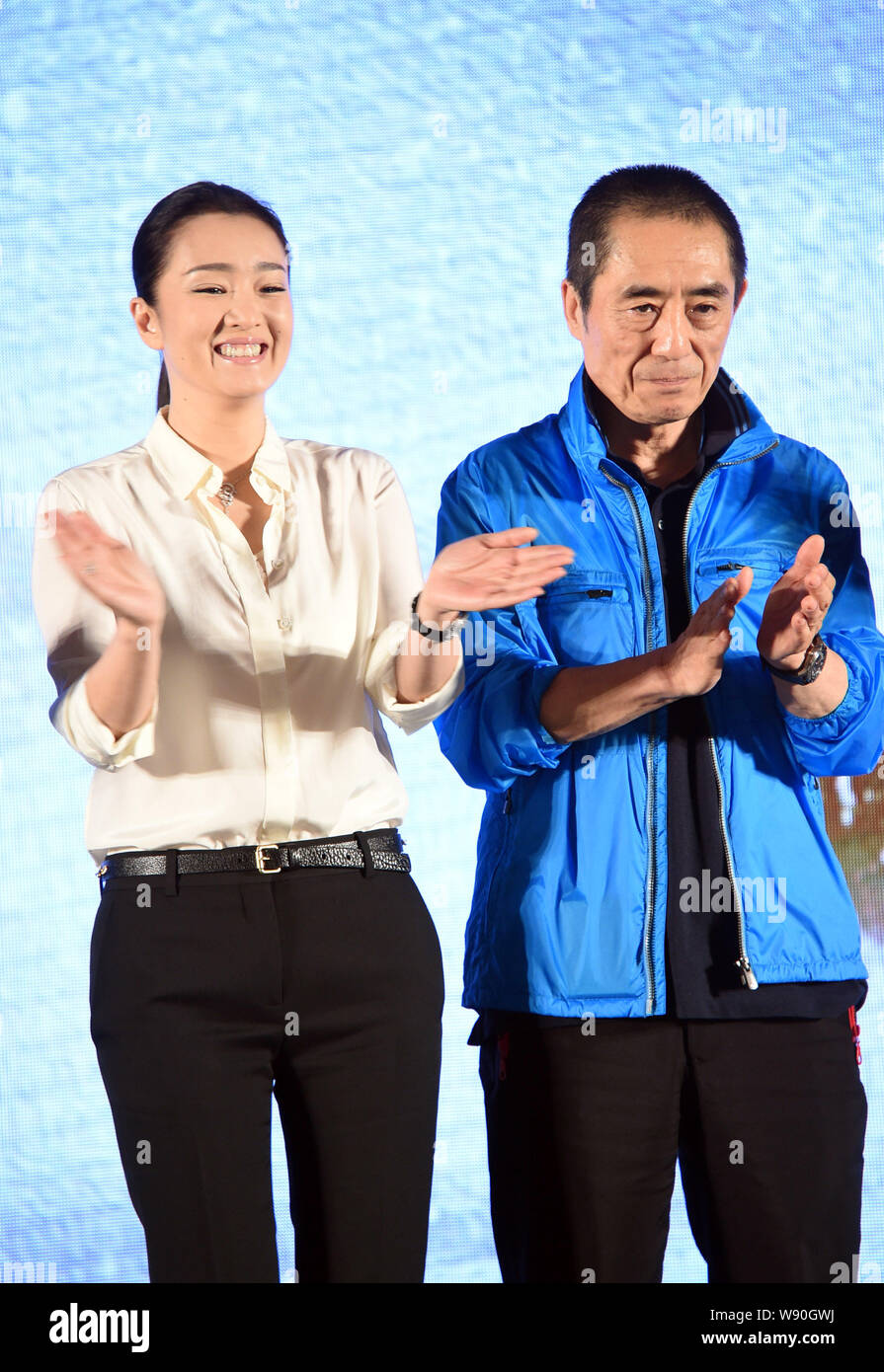 Chinese Actress Gong Li Left And Chinese Director Zhang Yimou Applaud During A Press