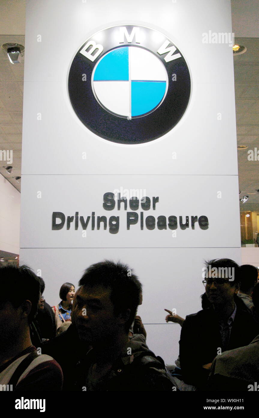 --FILE--Visitors crowd the stand of BMW during the 13th Beijing ...