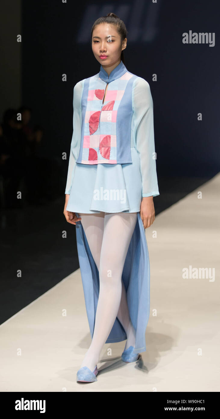 A model displays a creation by a postgraduate at a fashion show for ...