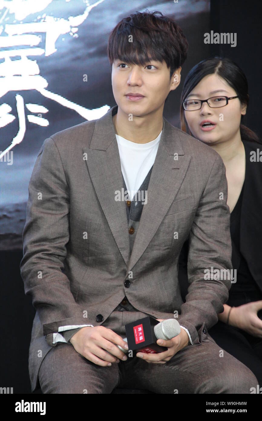 South Korean singer and actor Lee Min-ho, front, listens to an ...