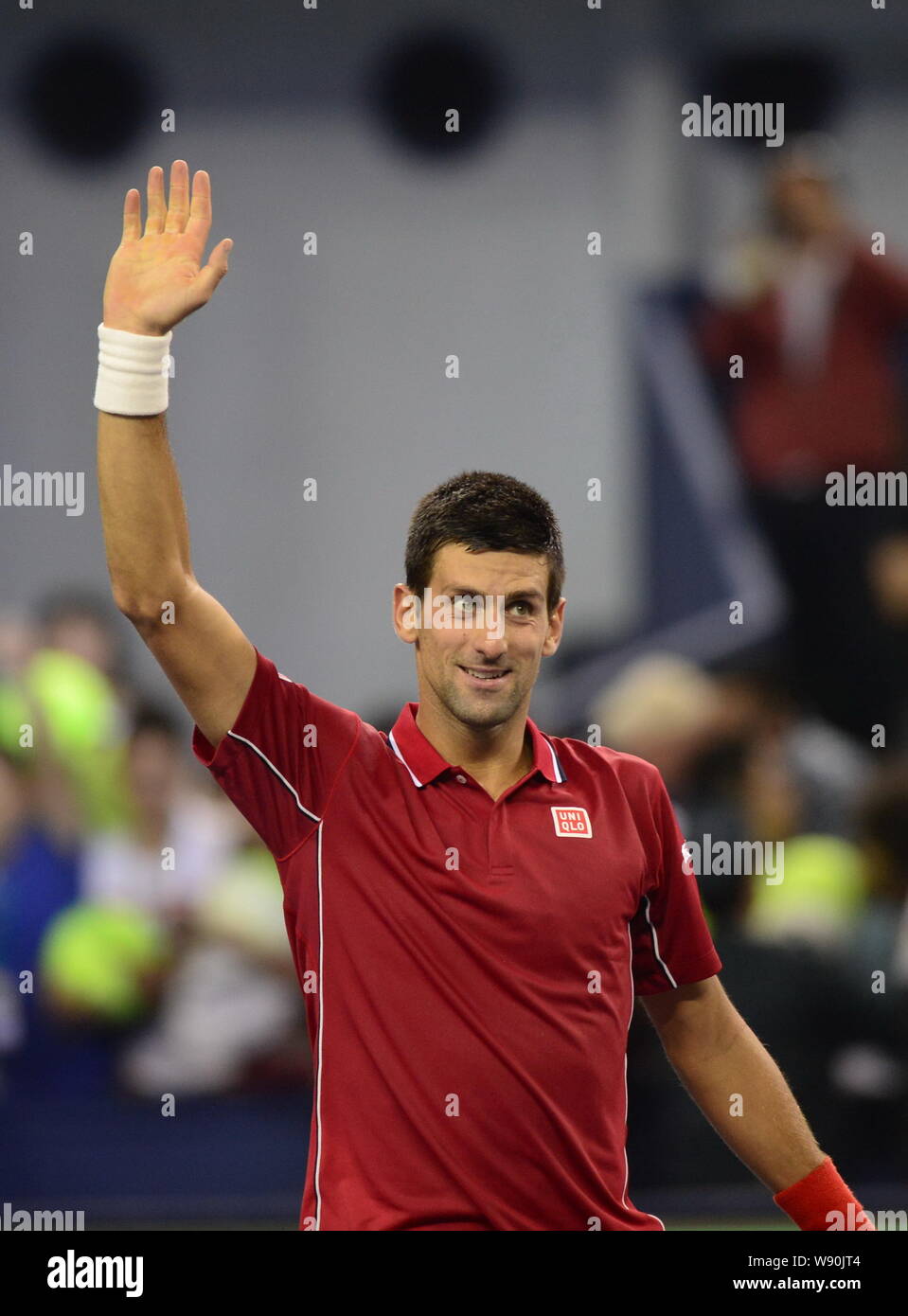 Novak Djokovic of Serbia waves after defeating David Ferrer of Spain in ...