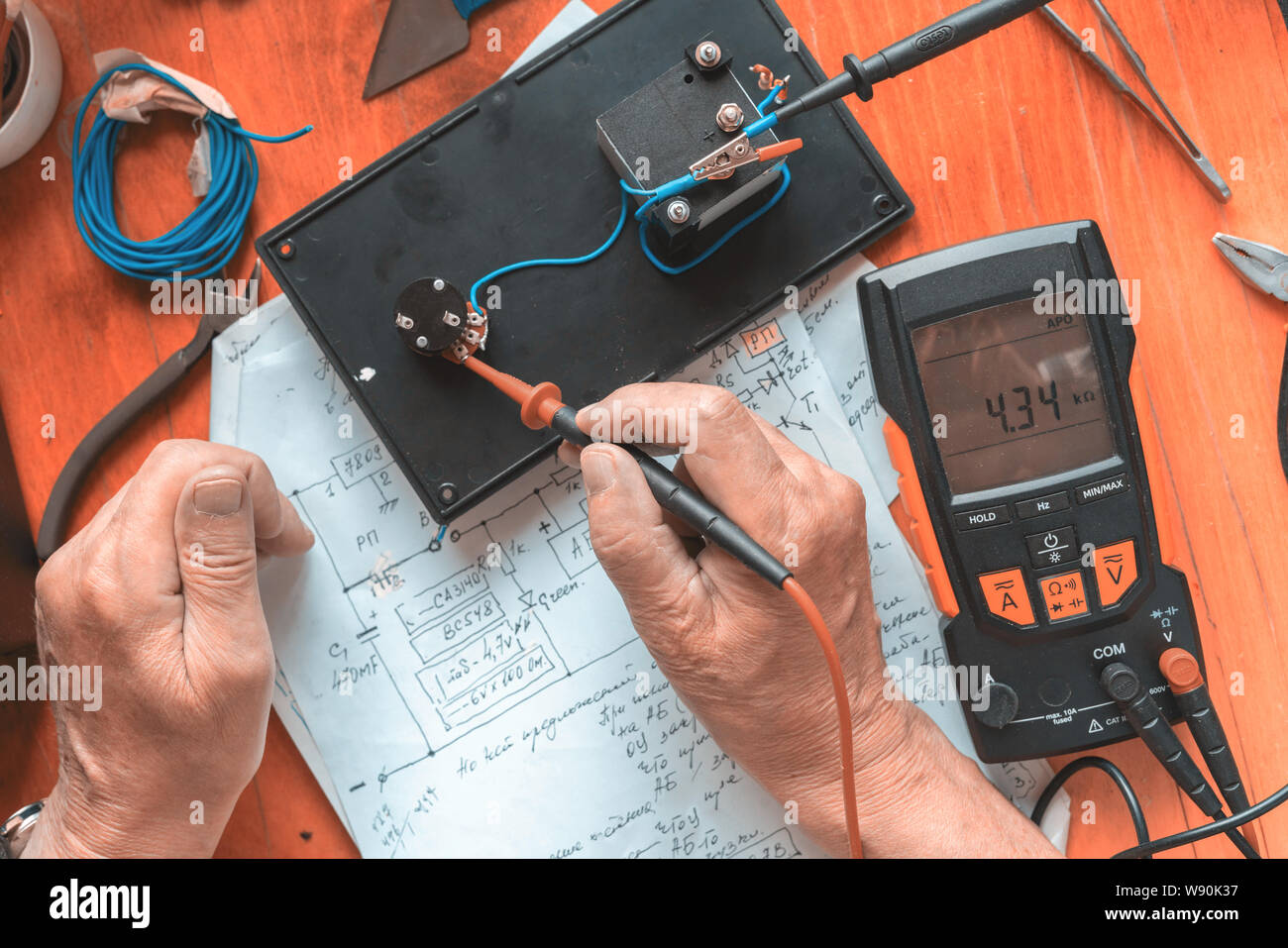 process of making electrical measurements with multimeter, testing the ...