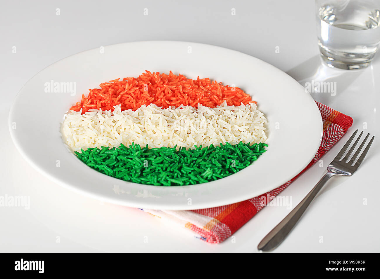 Rice served in a plate and representing Indian Flag Stock Photo - Alamy